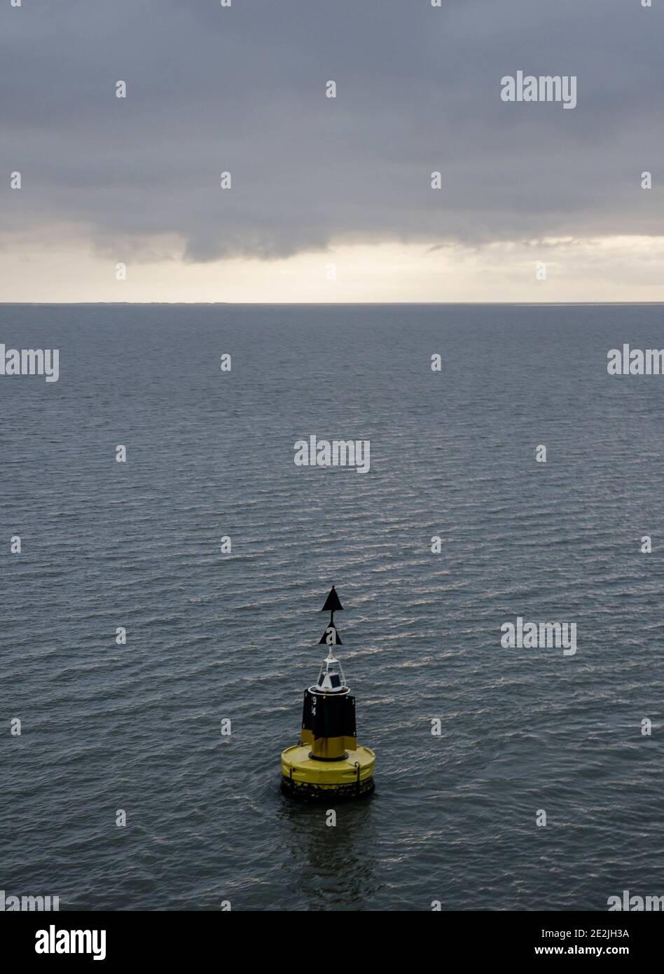 Vertical shot of a buoy floating in the middle of the ocean Stock Photo ...