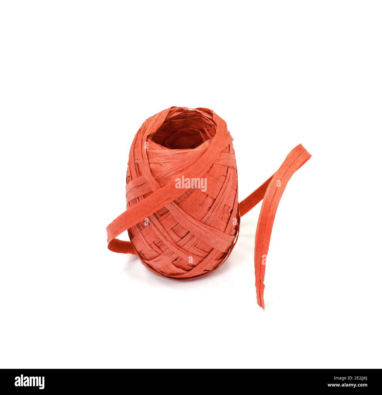 Paper Red ribbon roll isolated on white background Stock Photo - Alamy