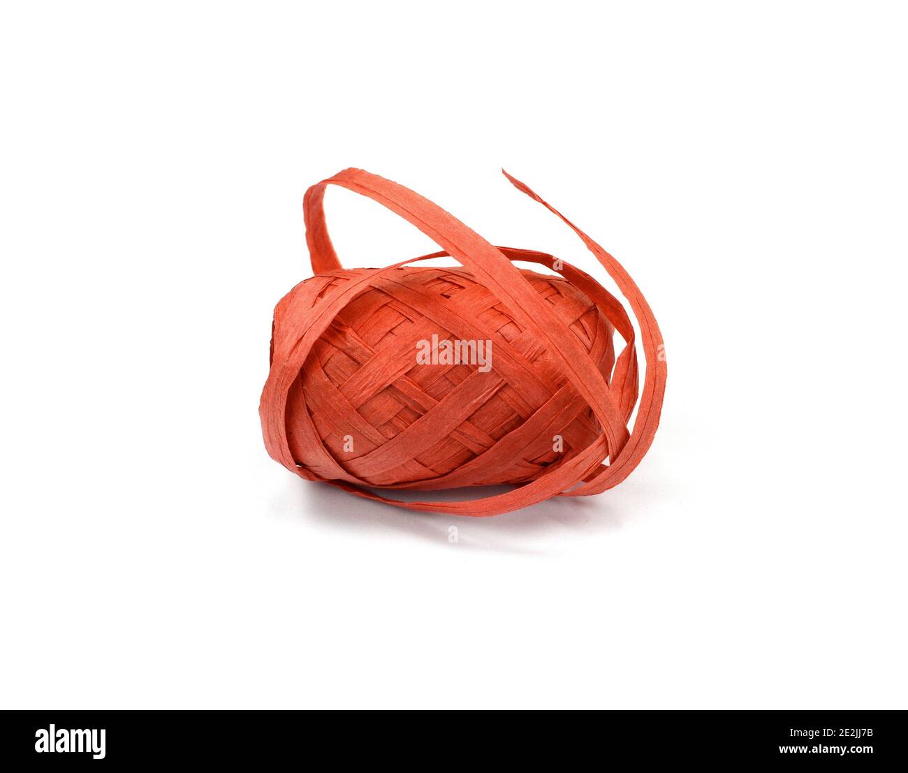 Paper Red ribbon roll isolated on white background Stock Photo - Alamy