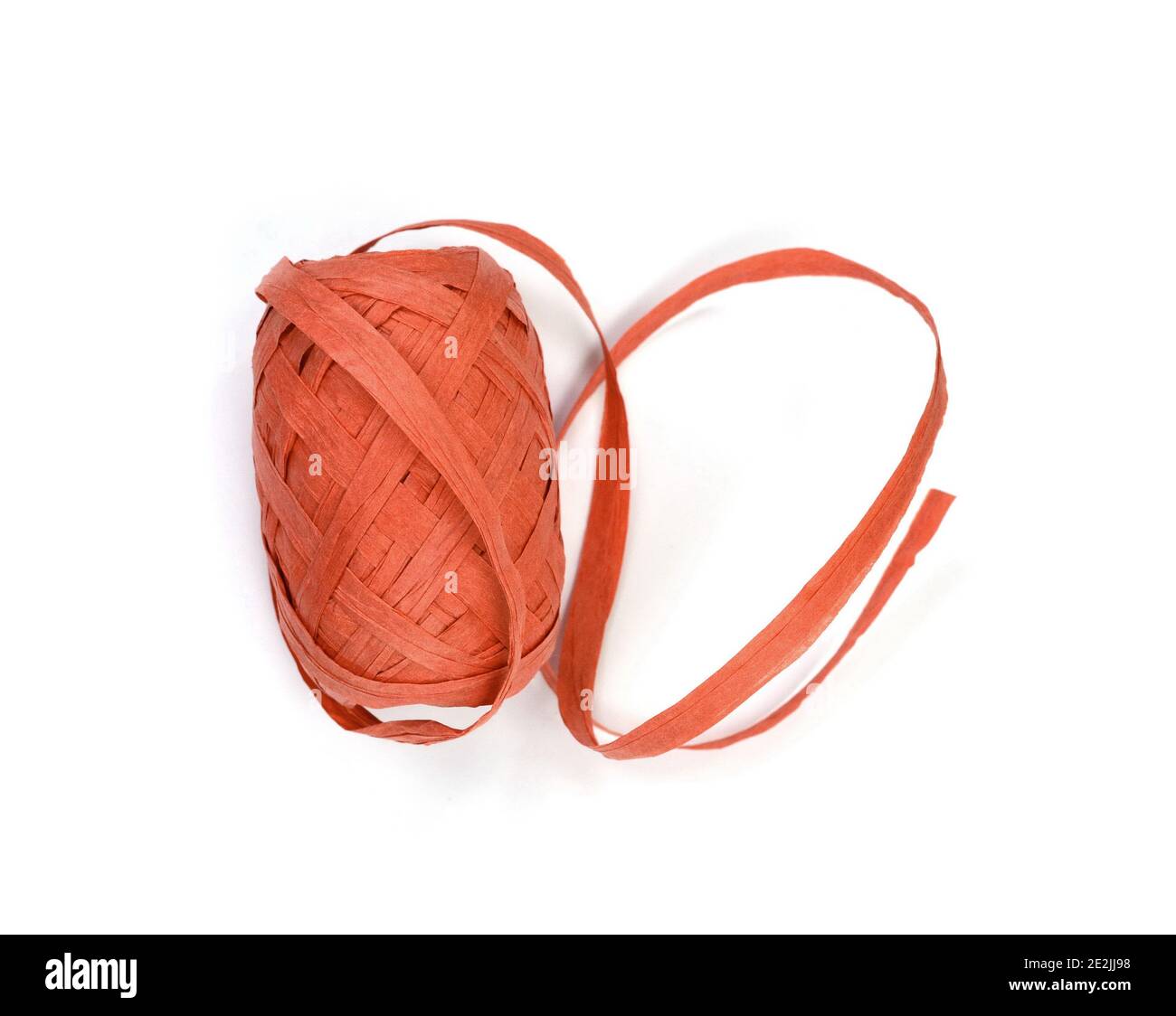 Paper Red ribbon roll isolated on white background Stock Photo - Alamy