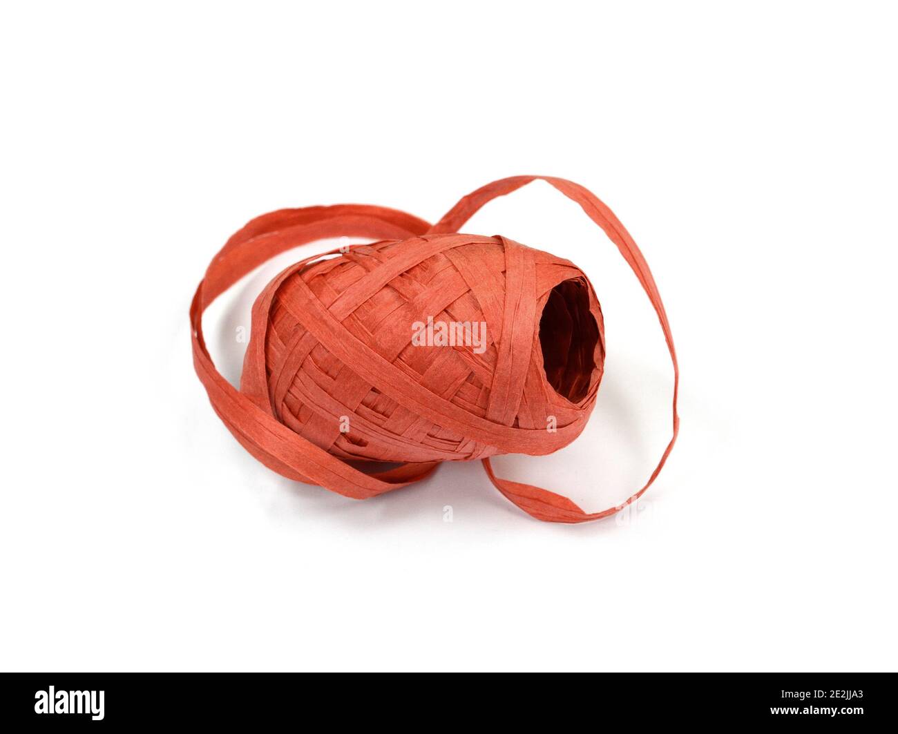 Paper Red ribbon roll isolated on white background Stock Photo - Alamy