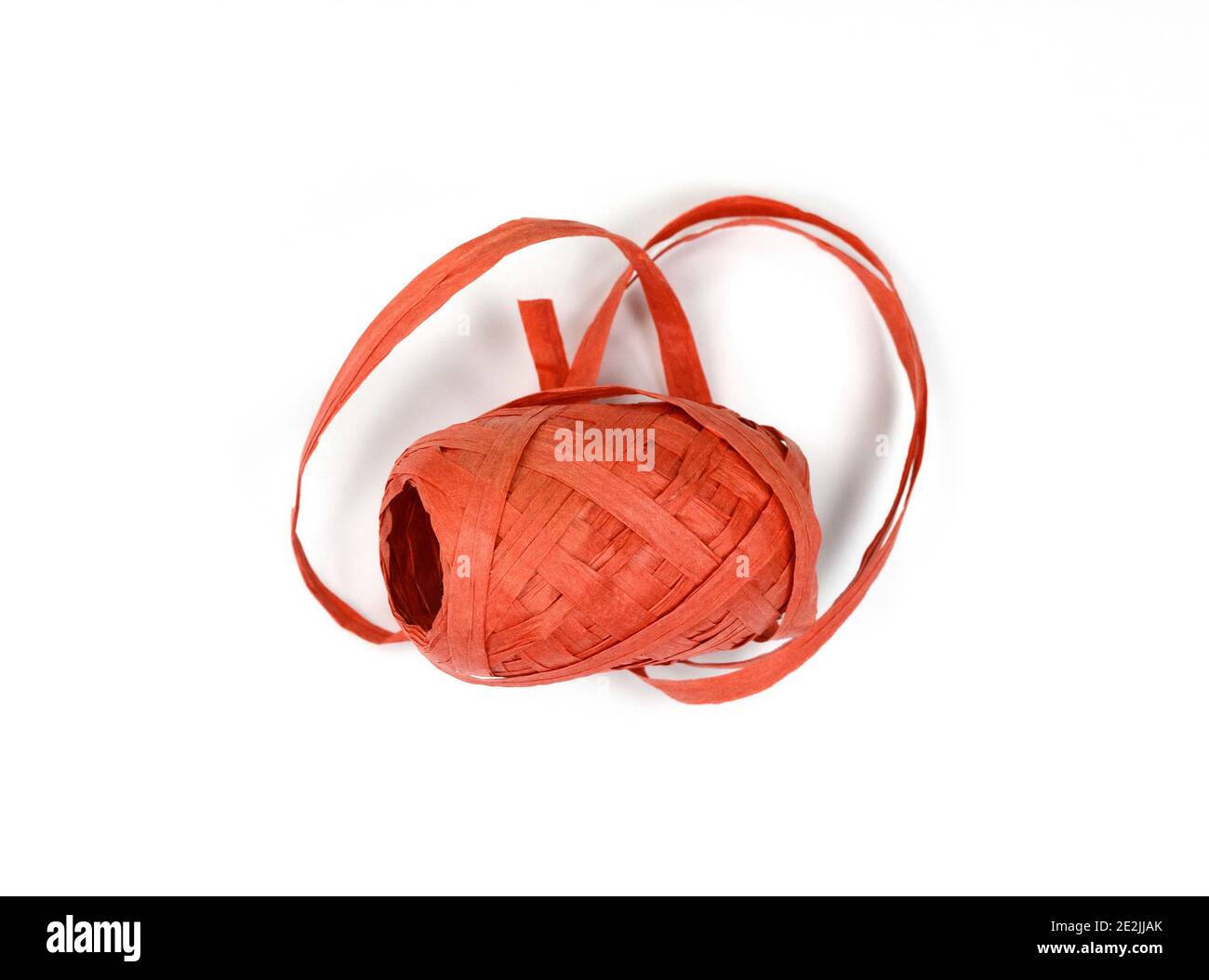 Paper Red ribbon roll isolated on white background Stock Photo - Alamy