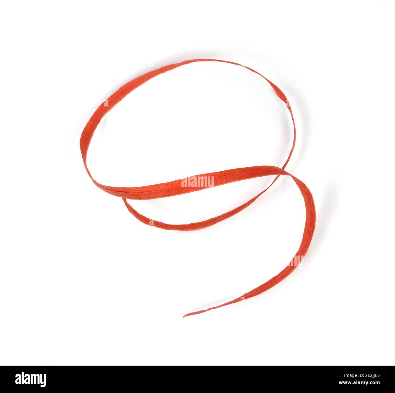 Paper Red ribbon roll isolated on white background Stock Photo - Alamy