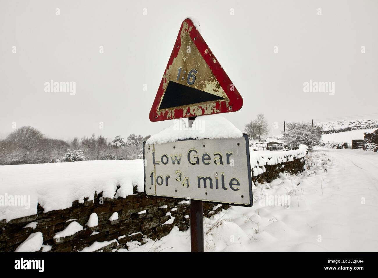 Deep snow after daylong snowfall the warning road sign on moorland ...