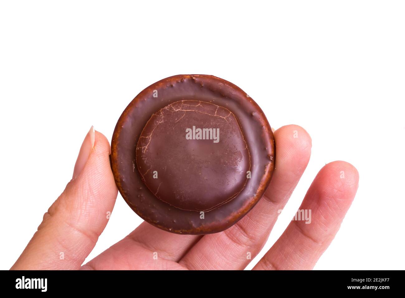 Cookie in hand isolated on a white background Stock Photo - Alamy