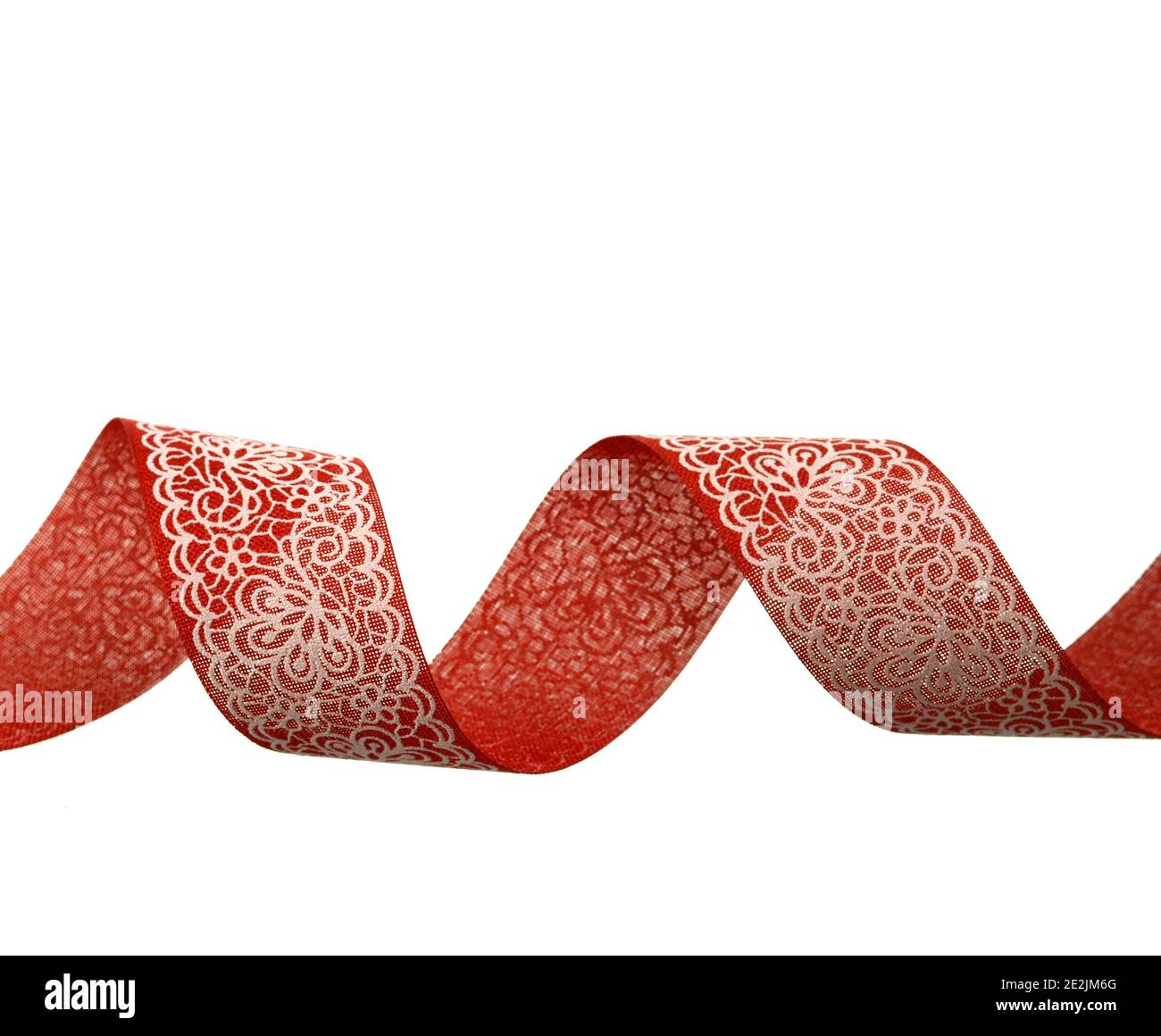 Red ribbon roll isolated on white background Stock Photo - Alamy