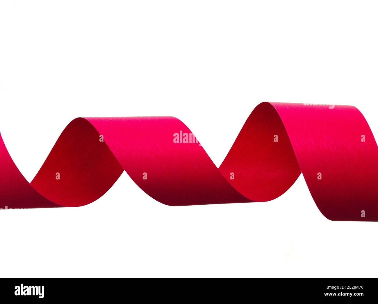 Red ribbon roll isolated on white background Stock Photo - Alamy