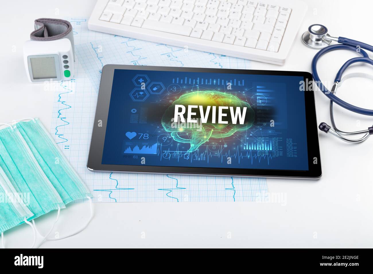 Tablet pc and medical tools with REVIEW inscription, social distancing ...