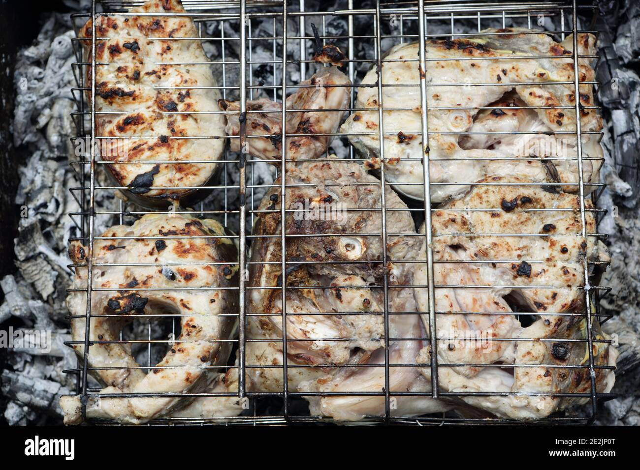 Cooking catfish slices on the grill on picnic Stock Photo - Alamy