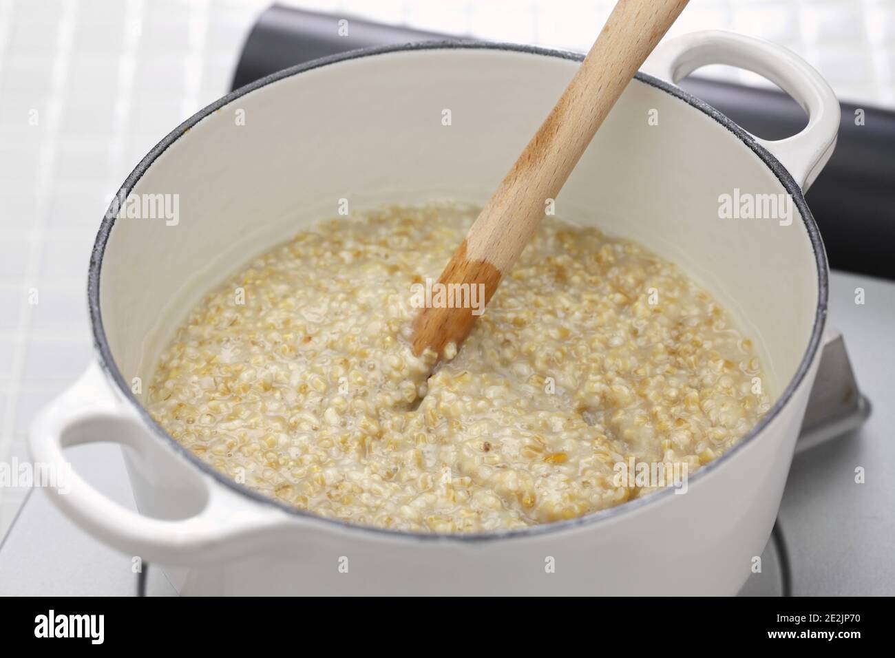 making traditional Scottish porridge by wooden spurtle Stock Photo - Alamy