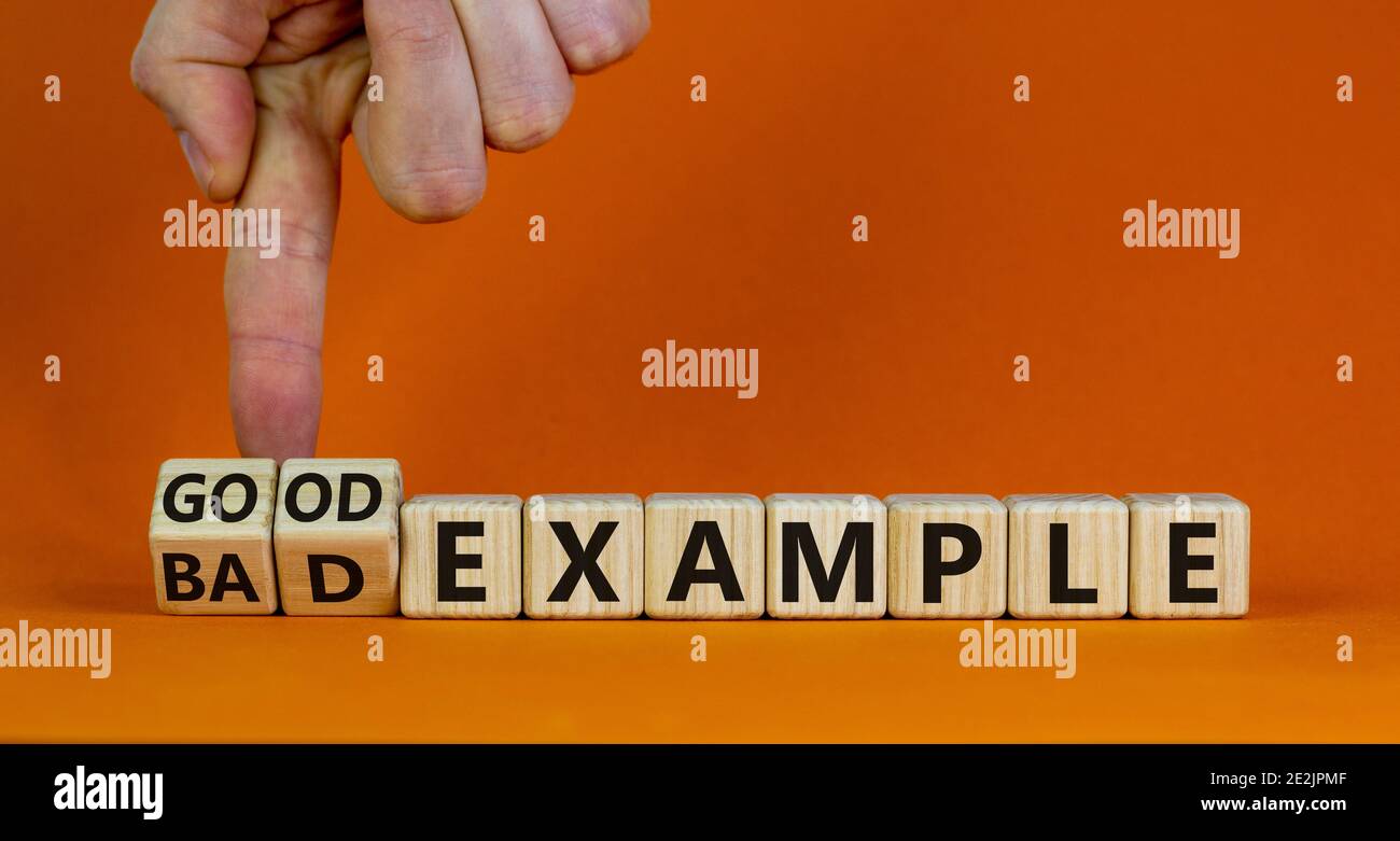 Good or bad example symbol. Businessman turns wooden cubes and changes ...