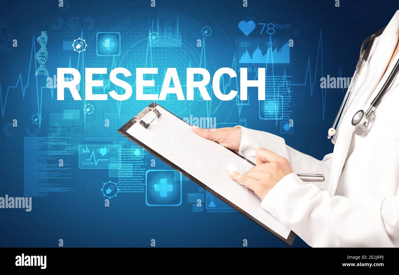 young doctor writing down notes with RESEARCH inscription, healthcare ...