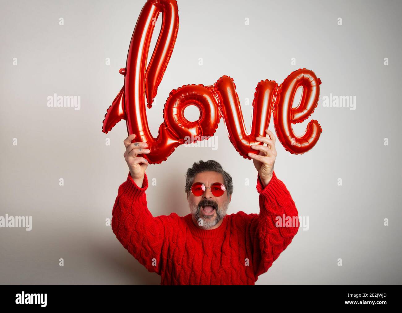 Male holding balloon word hi-res stock photography and images - Alamy