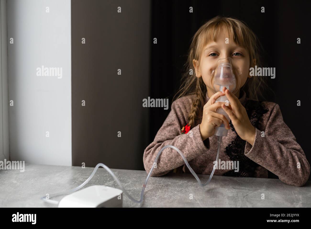 Little girl making inhalation with nebulizer at home. child asthma ...