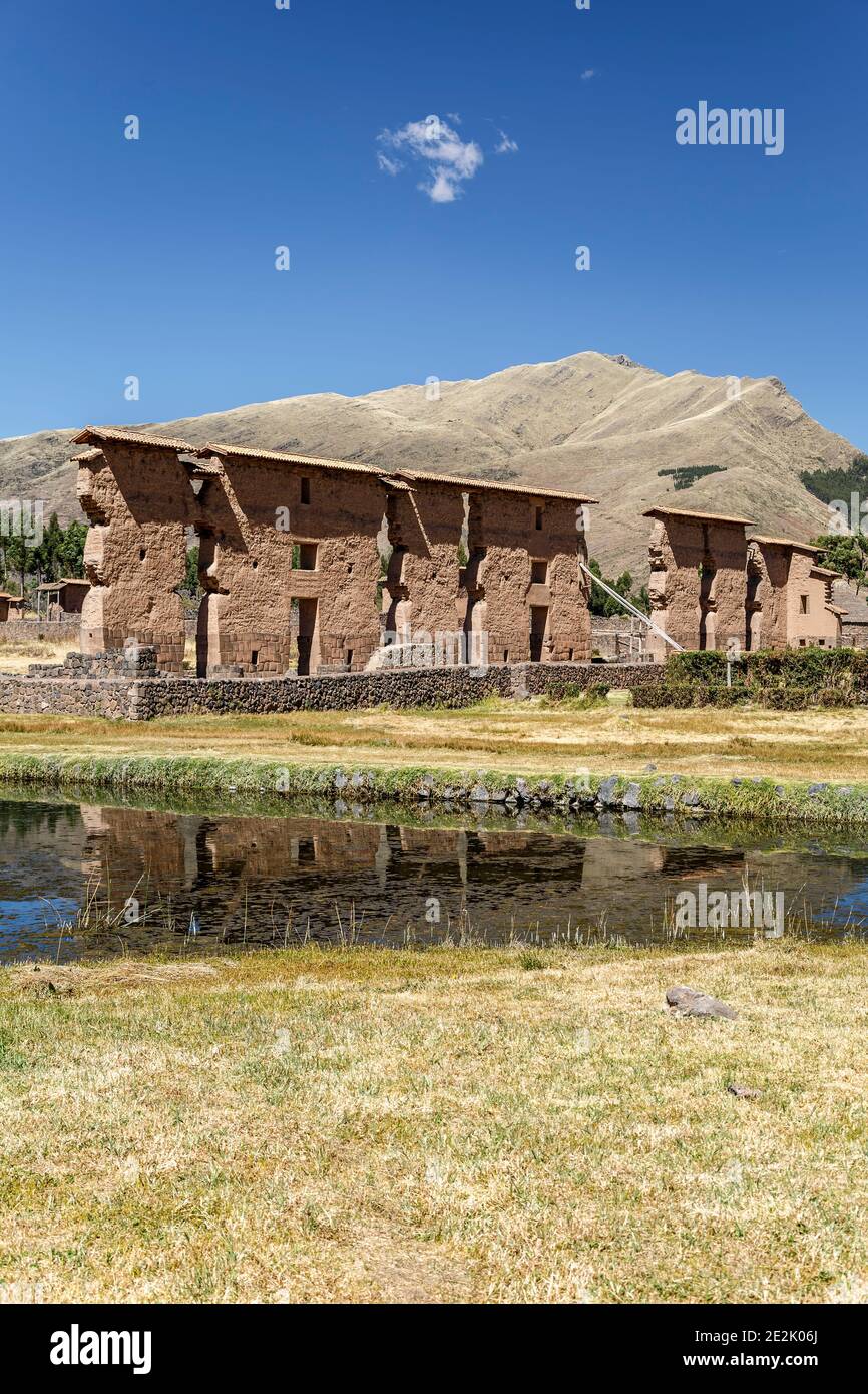 Brick walls of temple reflected on pond, Inca ruins, Raqchi, Cusco ...