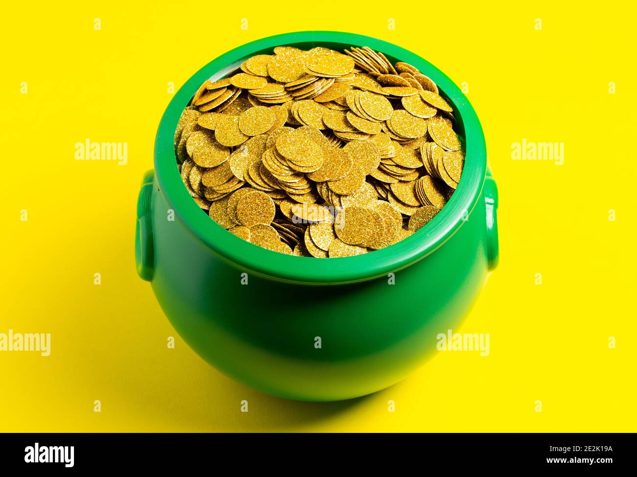 Green Pot Full of Golden Coins on a Bright Yellow Background Stock ...
