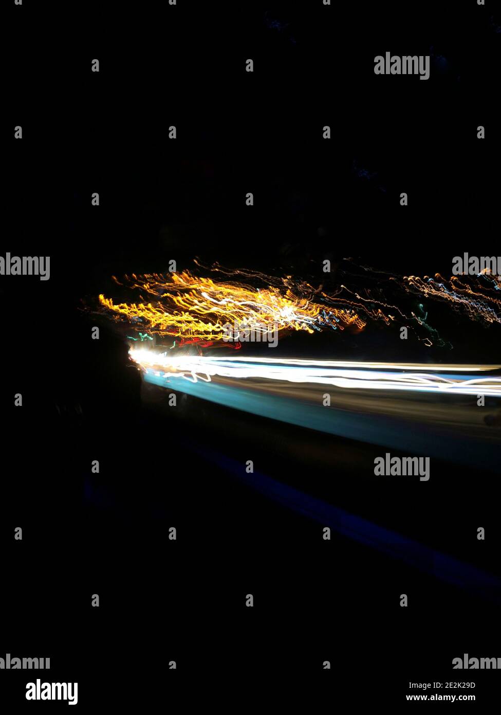 Vertical long exposure shot of colorful lights in the darkness Stock ...