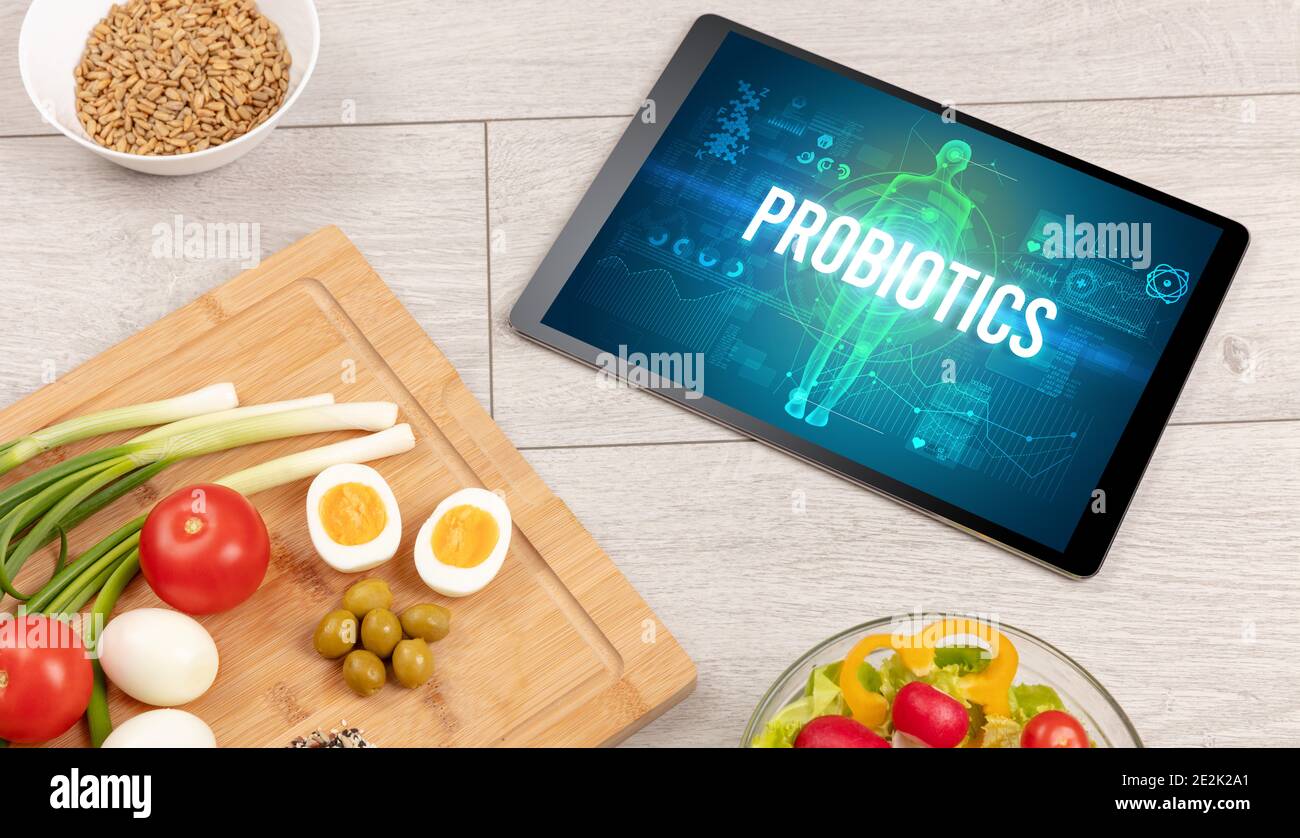 PROBIOTICS concept in tablet with fruits, top view Stock Photo - Alamy