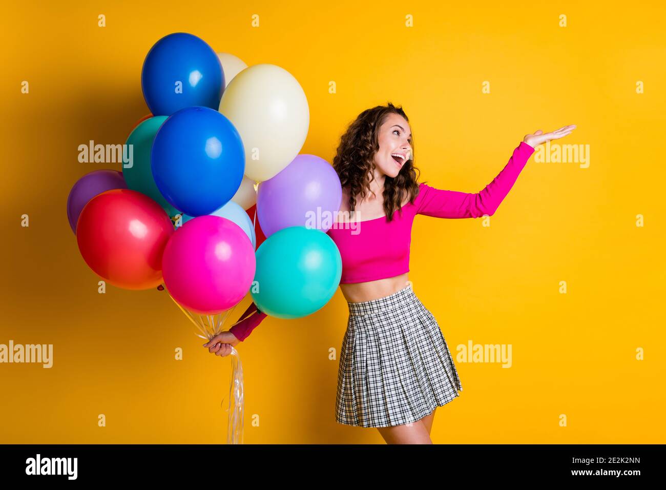 Portrait photo of happy female student holding air balloons smiling ...