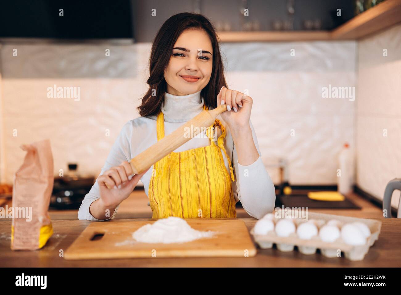 Happy attractive young adult woman lady housewife baker wear apron on ...