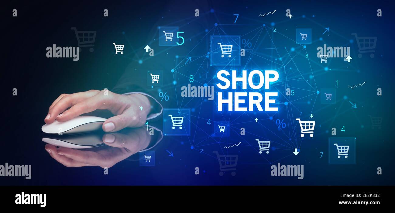 hand holding wireless peripheral with SHOP HERE inscription, online ...