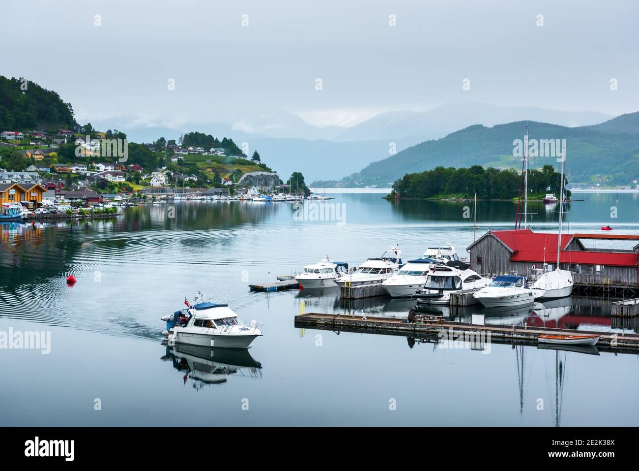Cloudy summer view of Hardangerfjord and Norheimsund village, Norway ...
