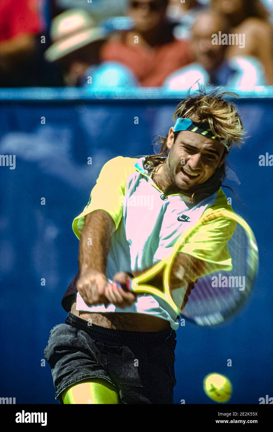 Andre Agassi (USA) competing at the 1990 US Open Tennis Championships ...