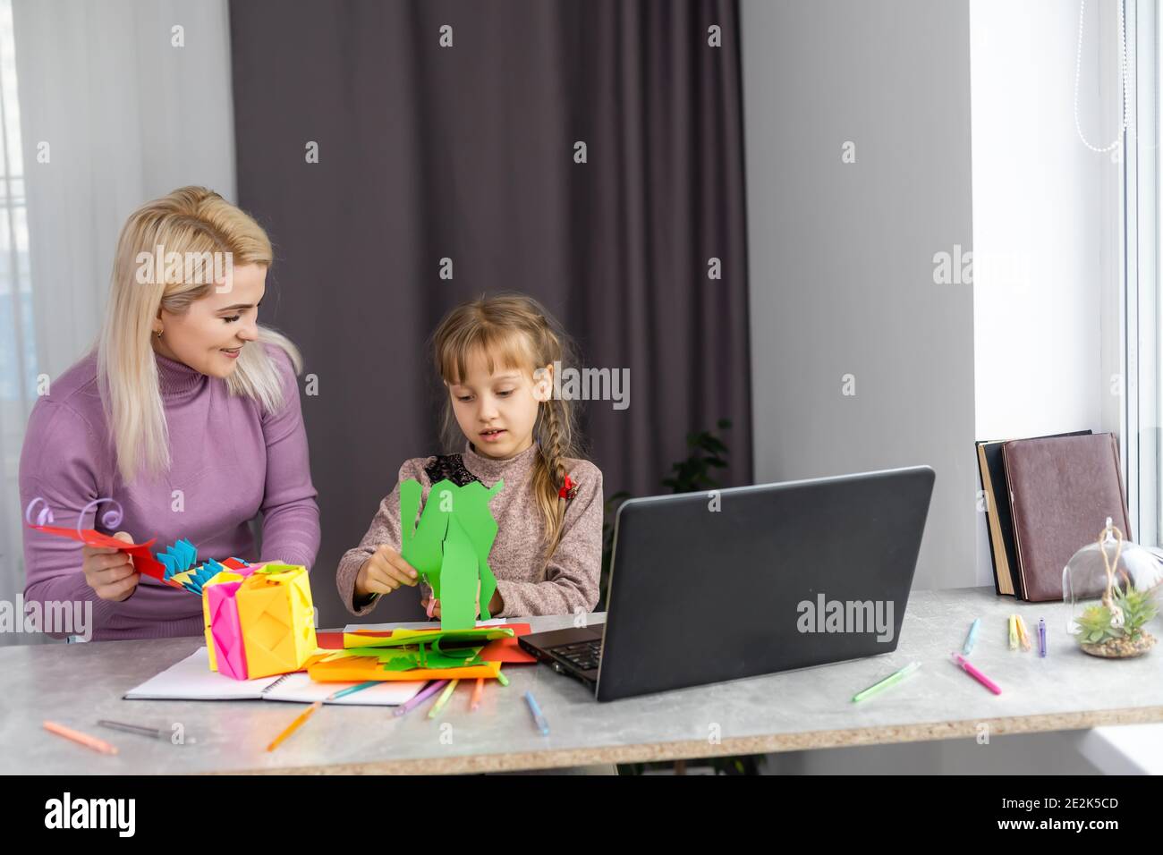 mother and daughter make paper crafts together Stock Photo - Alamy