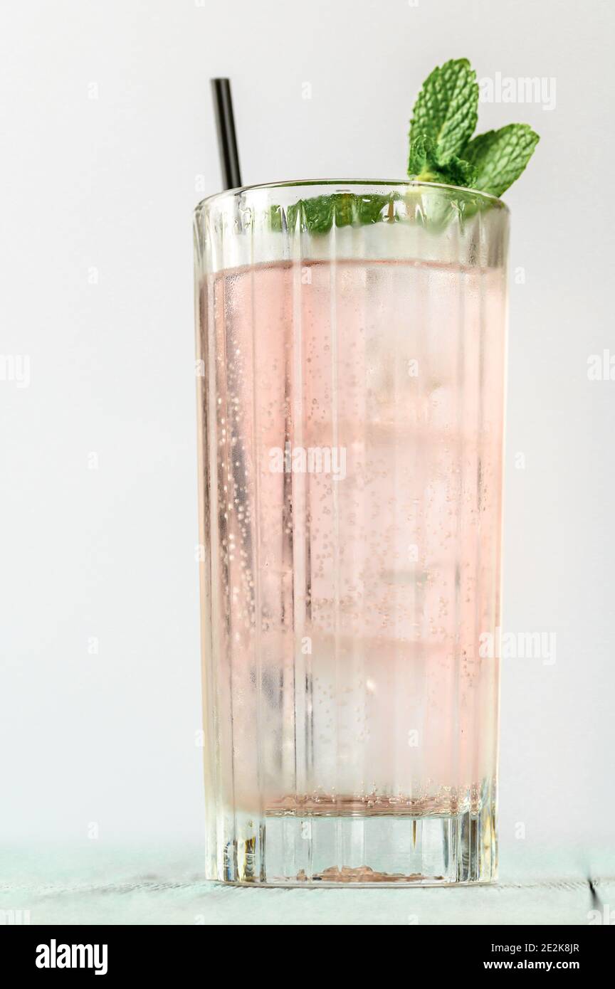 Glass of pink gin and tonic cocktail Stock Photo - Alamy