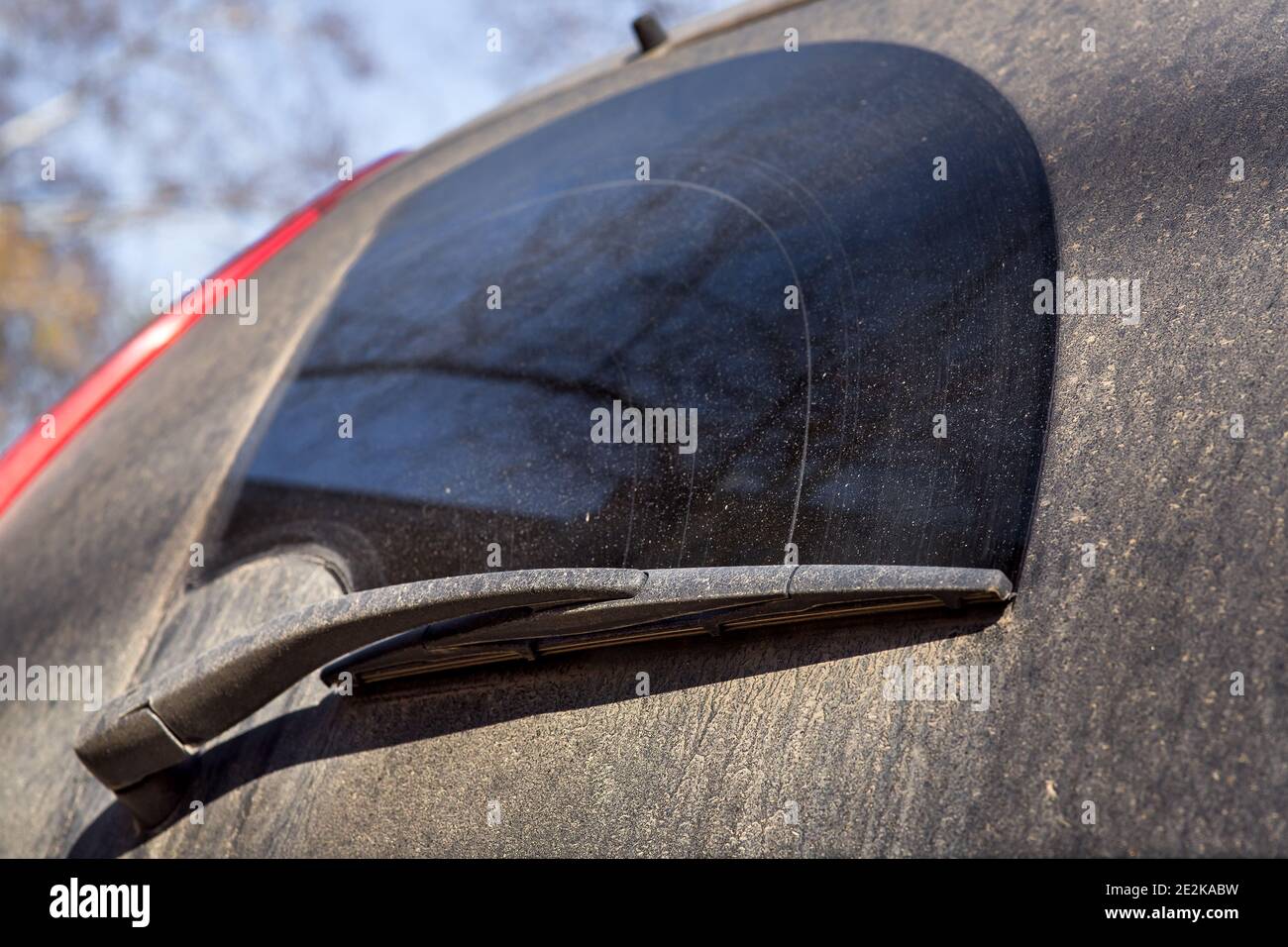 Close up of a dirty car wiper on a dirty back window in mud and divorce ...