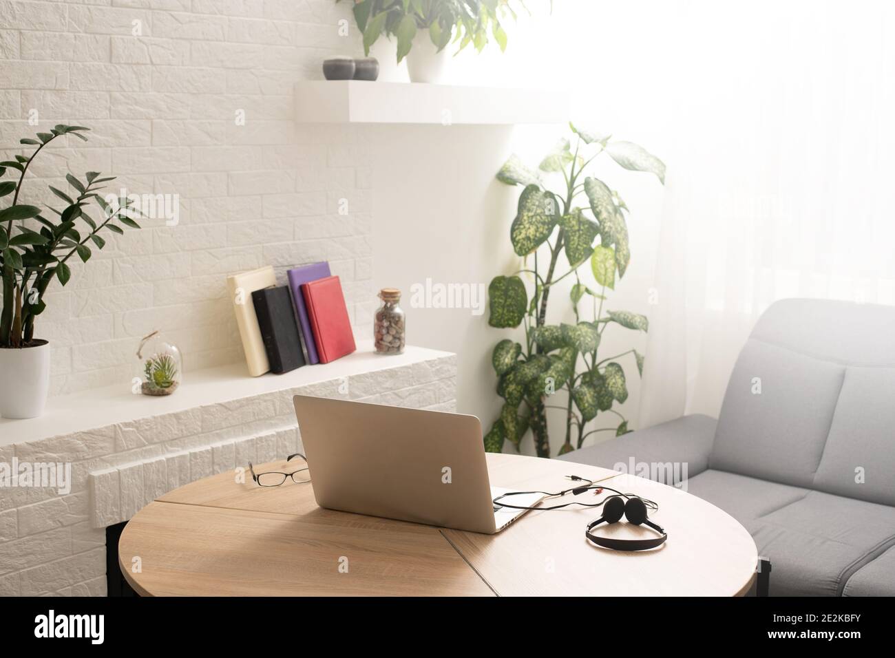 design of workplace with laptop in home office Stock Photo - Alamy