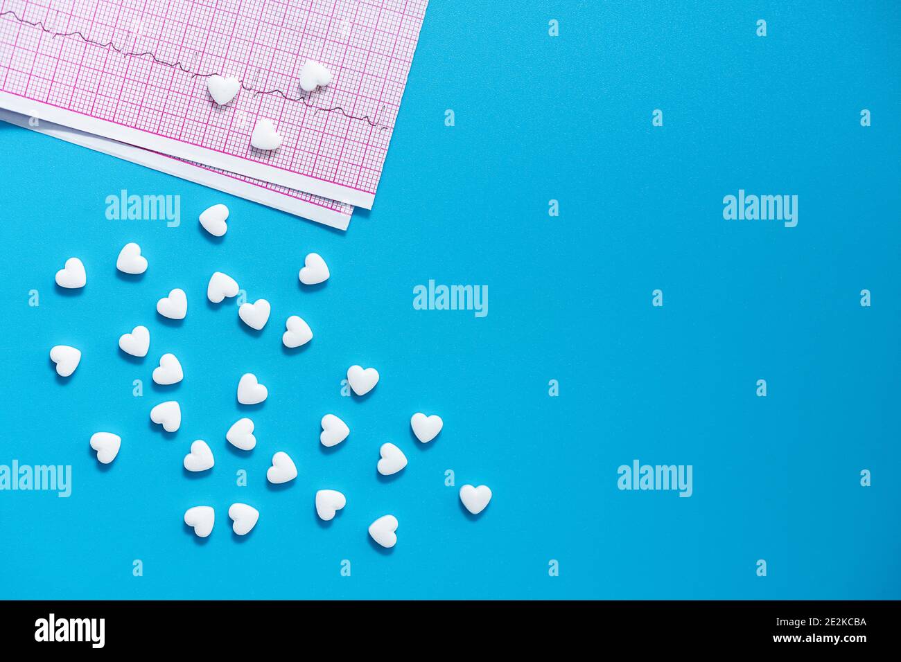 medical topic. Cardiology. electrocardiogram, heart-shaped tablets with ...