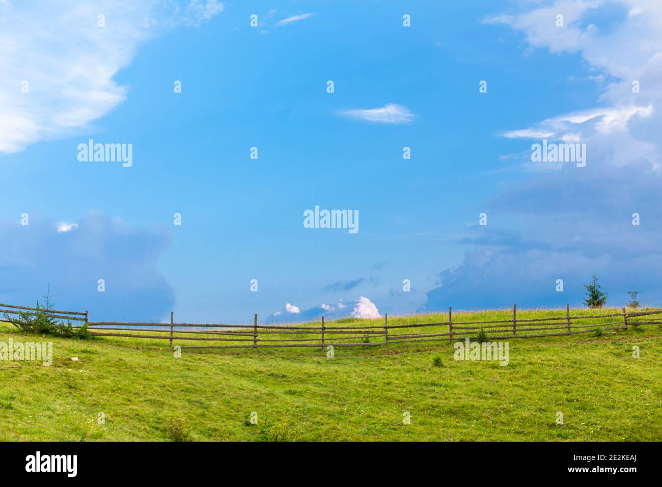 Mountain hills pure nature rural landscape. Fence from wooden logs ...