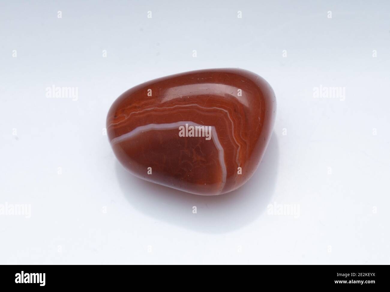 Natural stone carnelian on a white background Stock Photo - Alamy