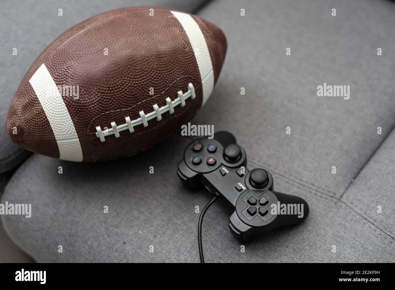 rugby ball and joystick for playing video games Stock Photo - Alamy