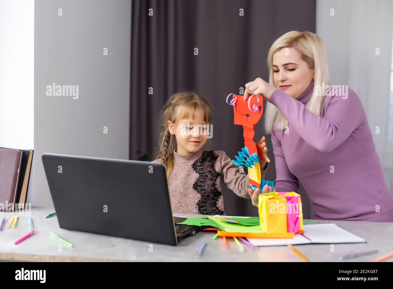 mother and daughter make paper crafts together Stock Photo - Alamy