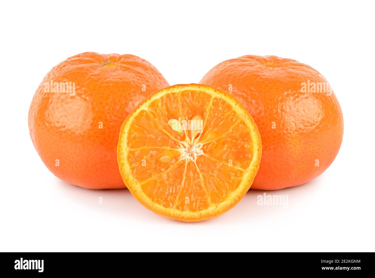 Two tangerine and half isolated on white background Stock Photo - Alamy