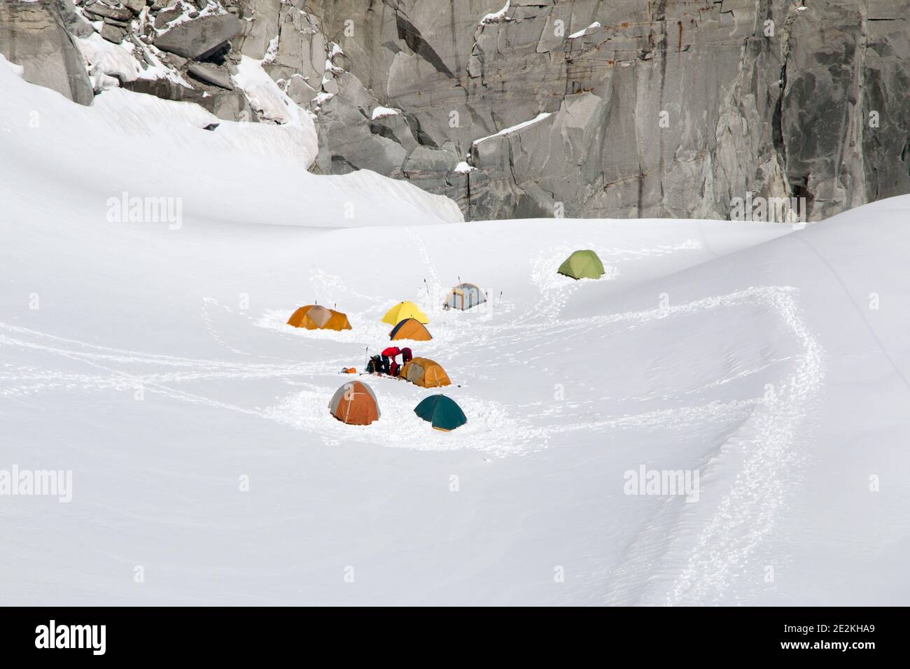 Tent base camp in the snow set in extreme high alpine environment in ...