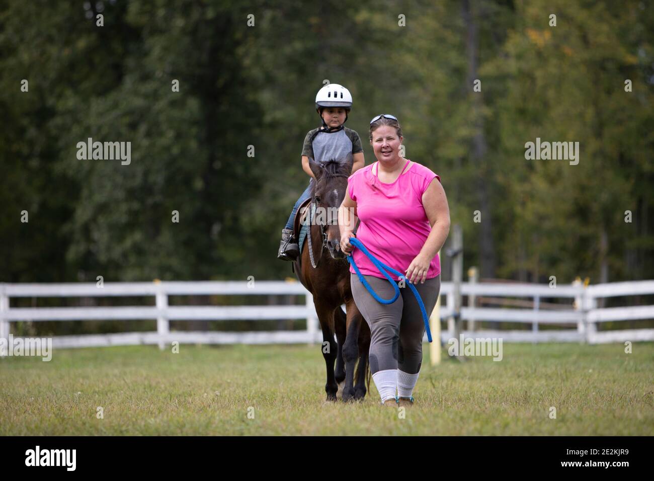 Woman riding pony hi-res stock photography and images - Alamy