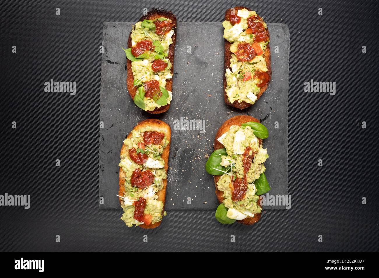 Sandwiches on a square tray. Black slate tray Stock Photo - Alamy