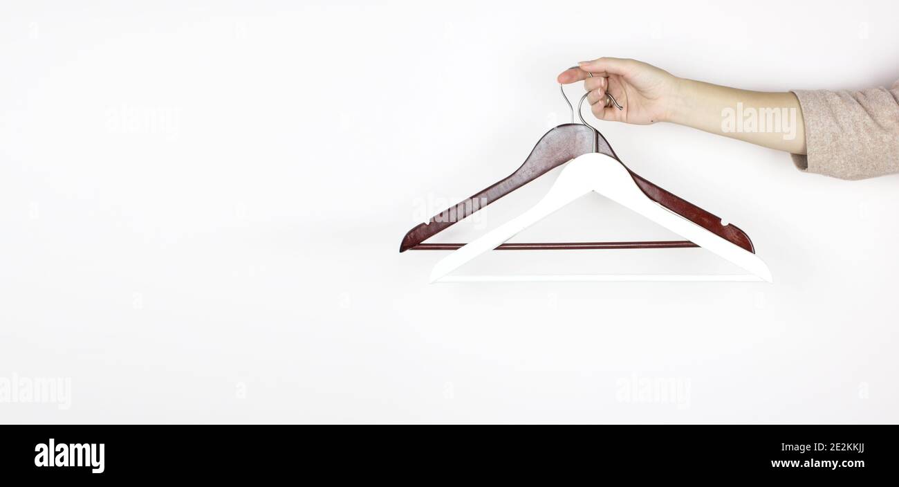 Hand holding hanger hi-res stock photography and images - Alamy