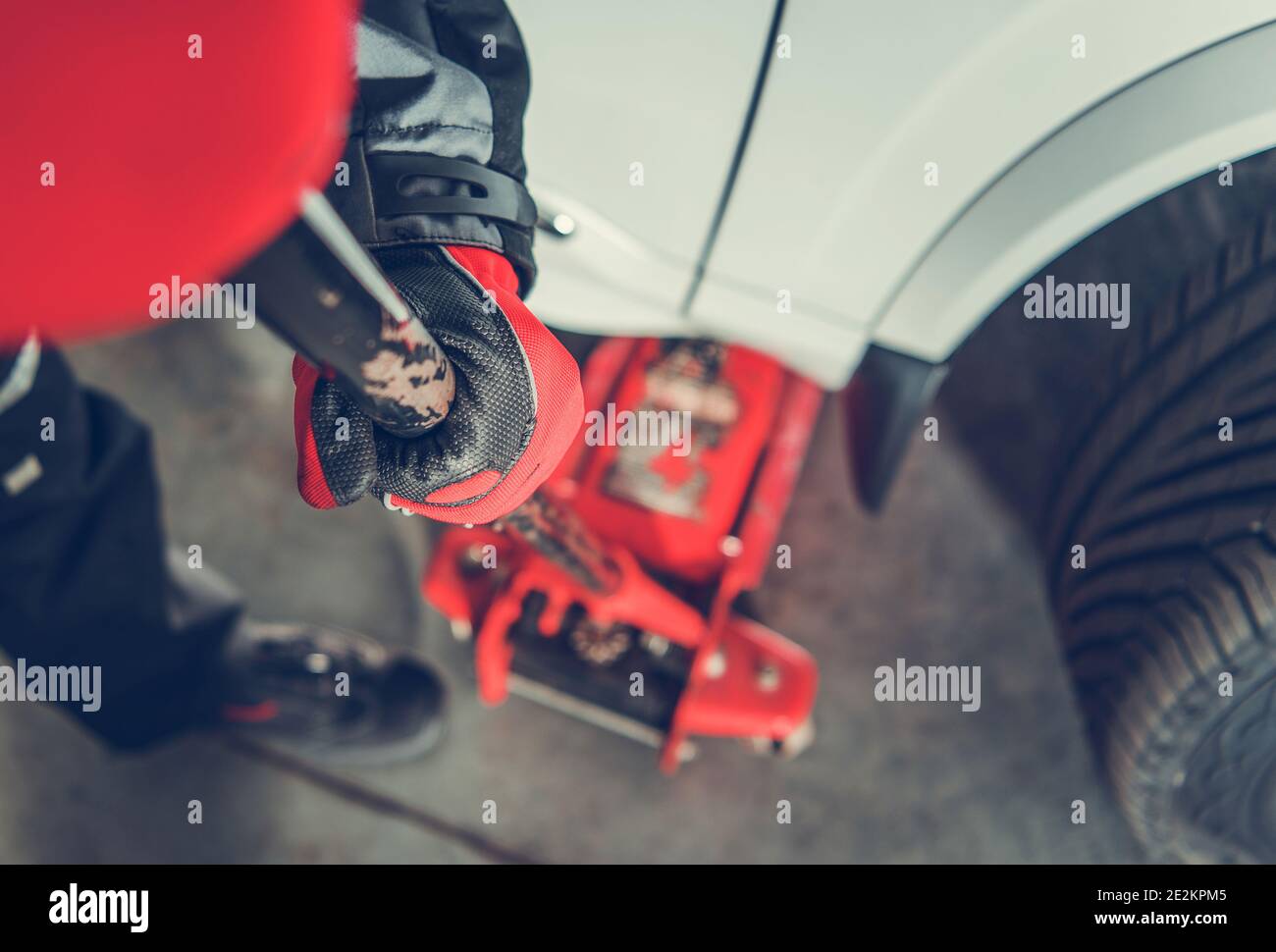 Car Service Mechanic Lifting Car Using Lift Jack Close Up. Automotive ...