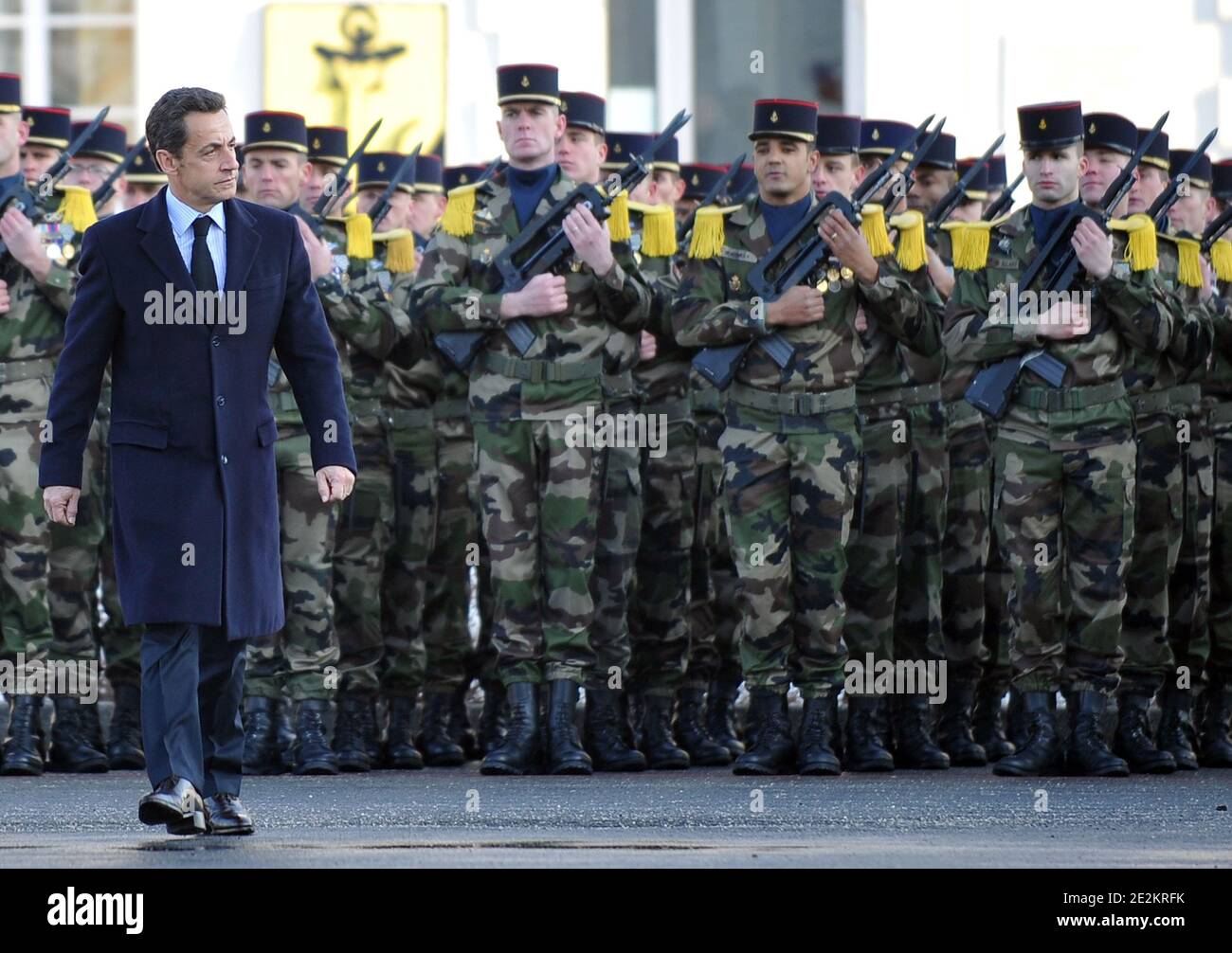 French President Nicolas Sarkozy reviews troops as he arrives at third ...