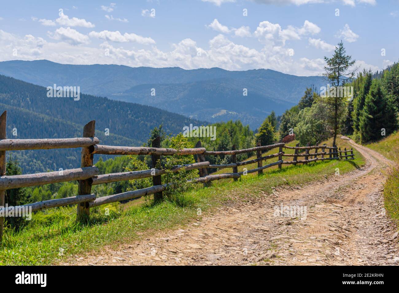 Mountain hills pure nature rural landscape. Fence from wooden logs ...