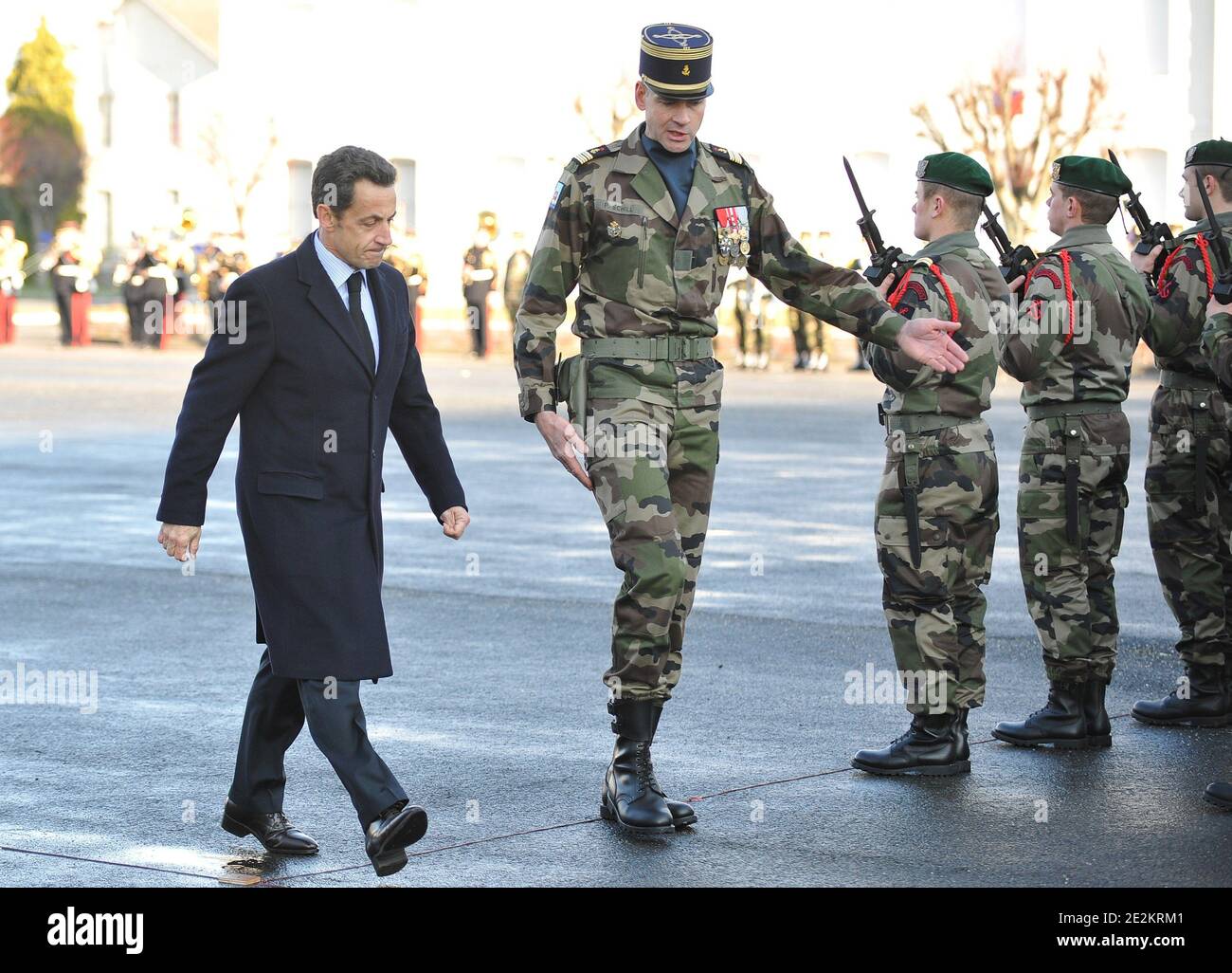 French President Nicolas Sarkozy Colonel Pierre Schill reviews troops ...