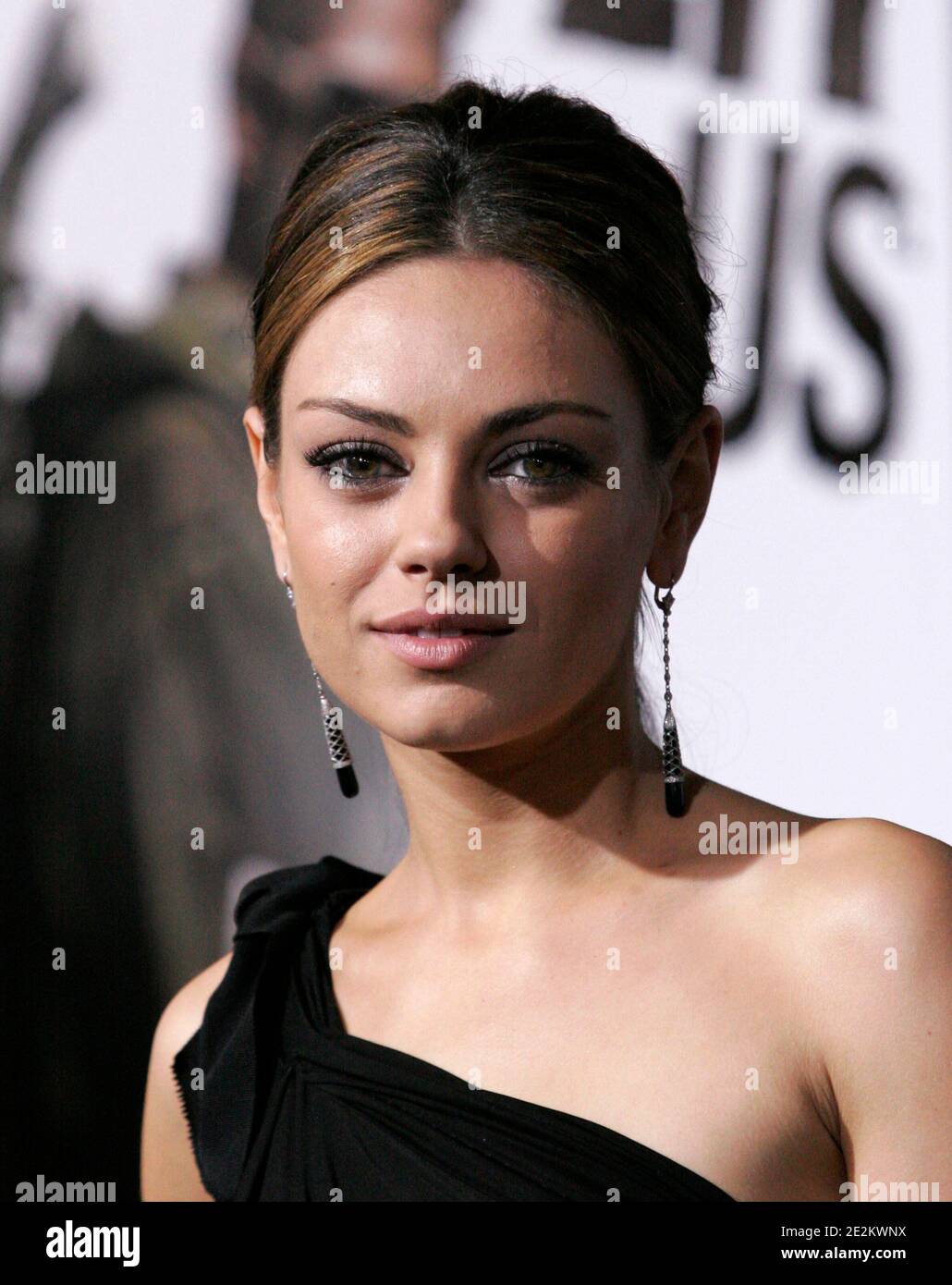 Mila Kunis arrives at The Los Angeles Premiere of The Book of Eli at ...