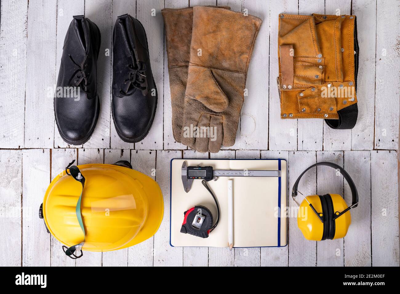 Workwear for a production worker on a white table. Personal protection ...