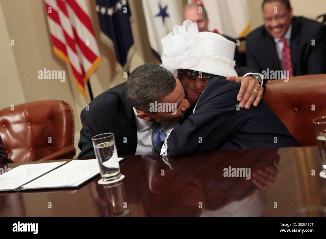 US President Barack Obama hugs with Mable Harvey before hosting a ...