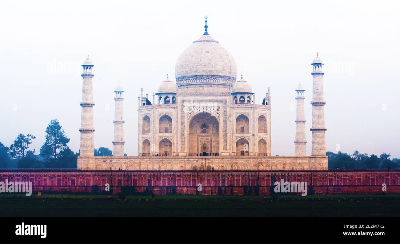 Idyllic indian landmark Taj Mahal. People at far distance . Awe ...