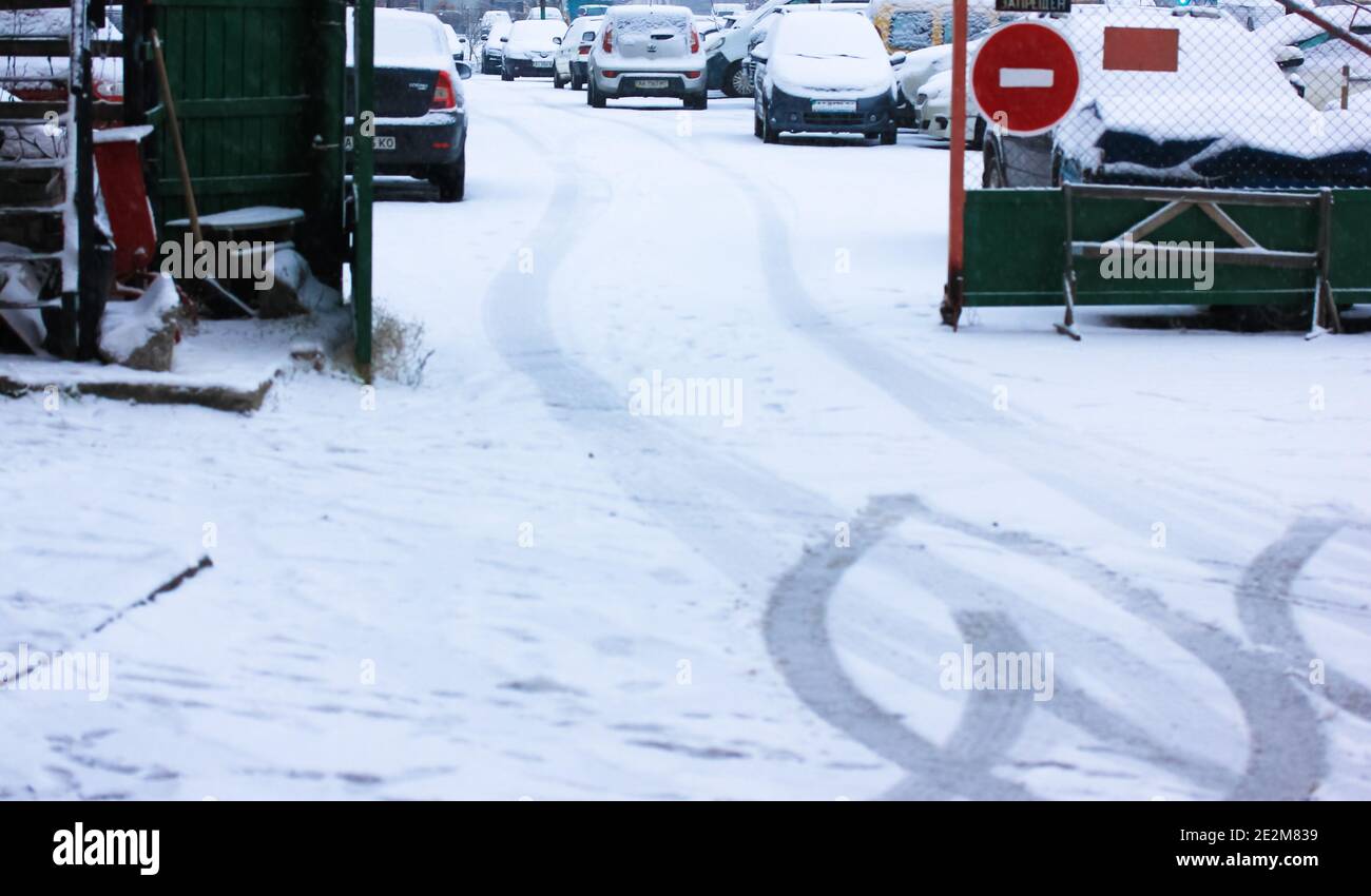 Entering parking lot among the high-rise buildings, no entry sign and a ...